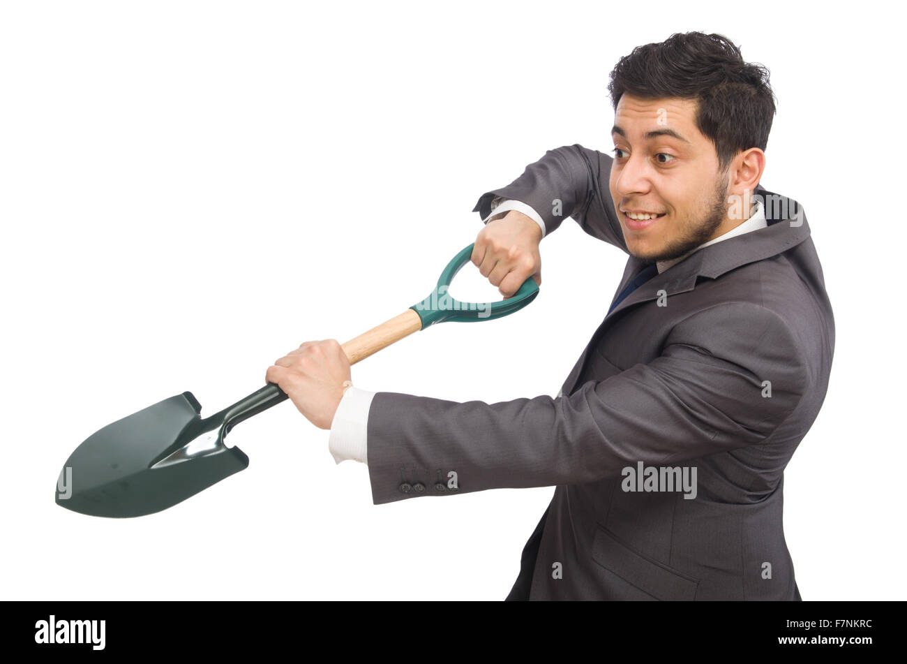 Young businessman holding a tool isolated on white Stock Photo - Alamy