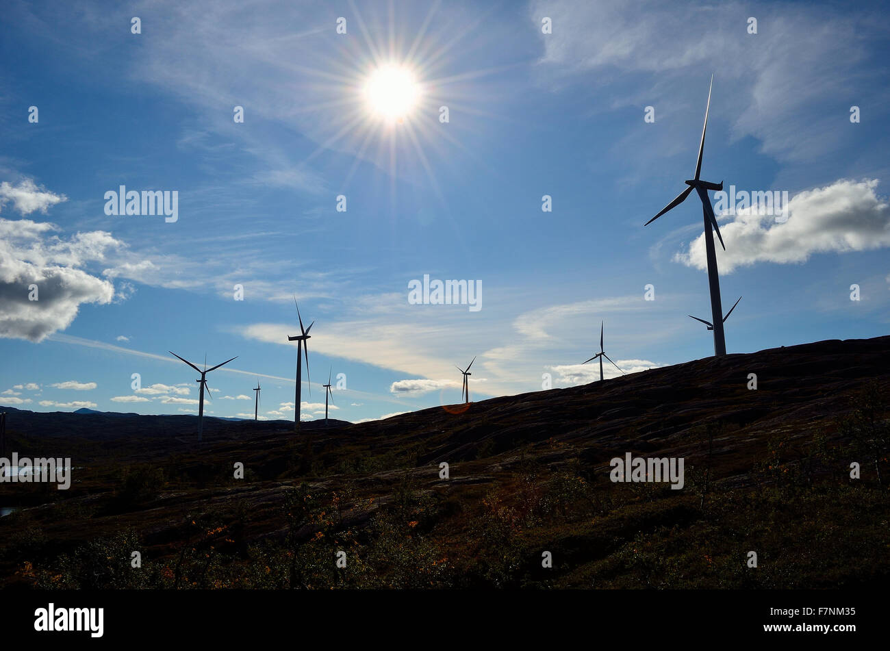 windmill farm on mountain top in autumn sun Stock Photo - Alamy