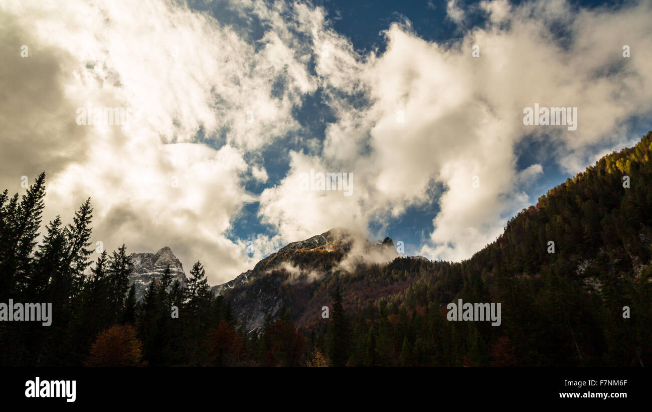 Fall in the italian alps in a misty day Stock Photo - Alamy