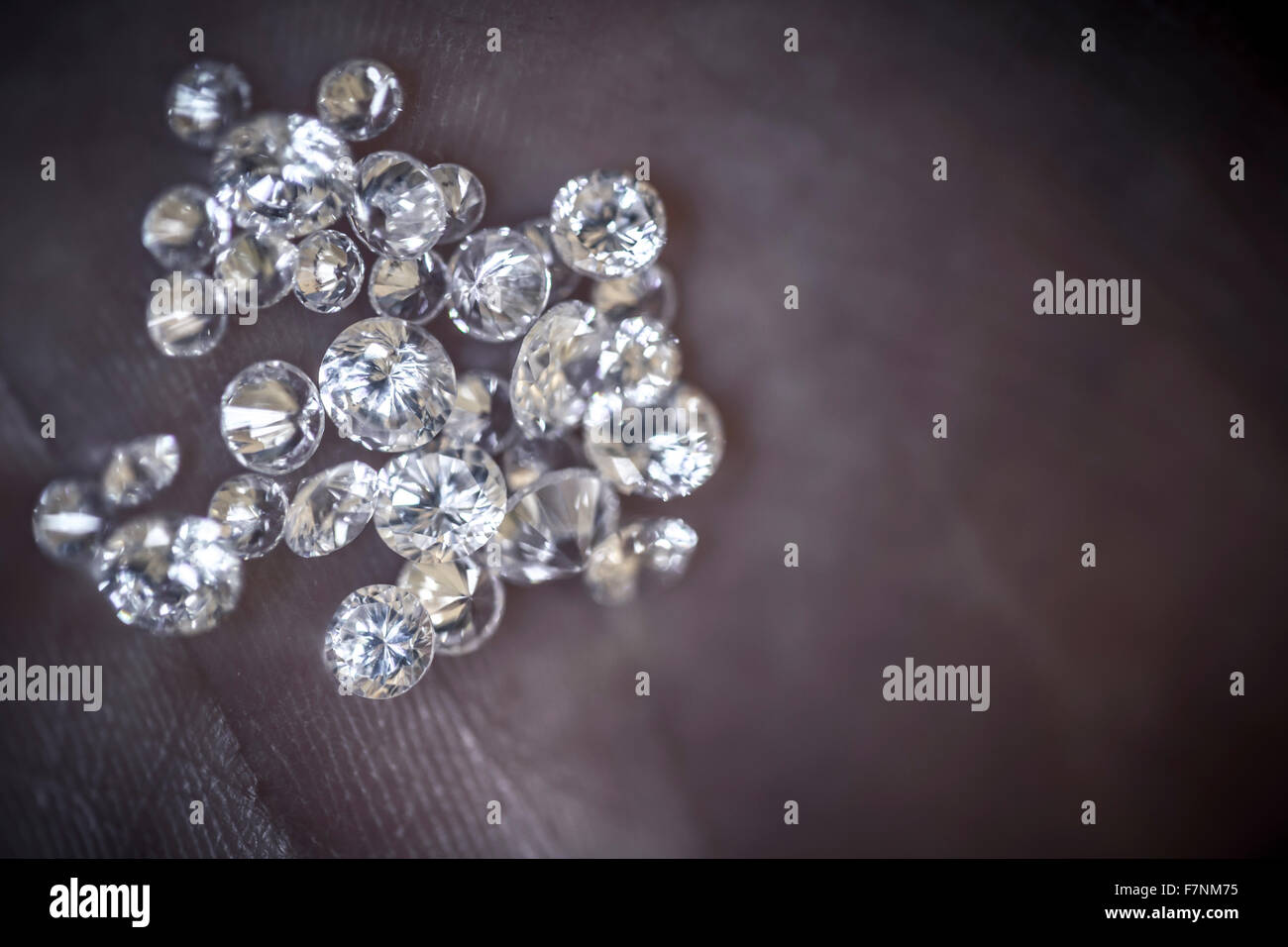 Diamonds in the palm of a hand Stock Photo - Alamy