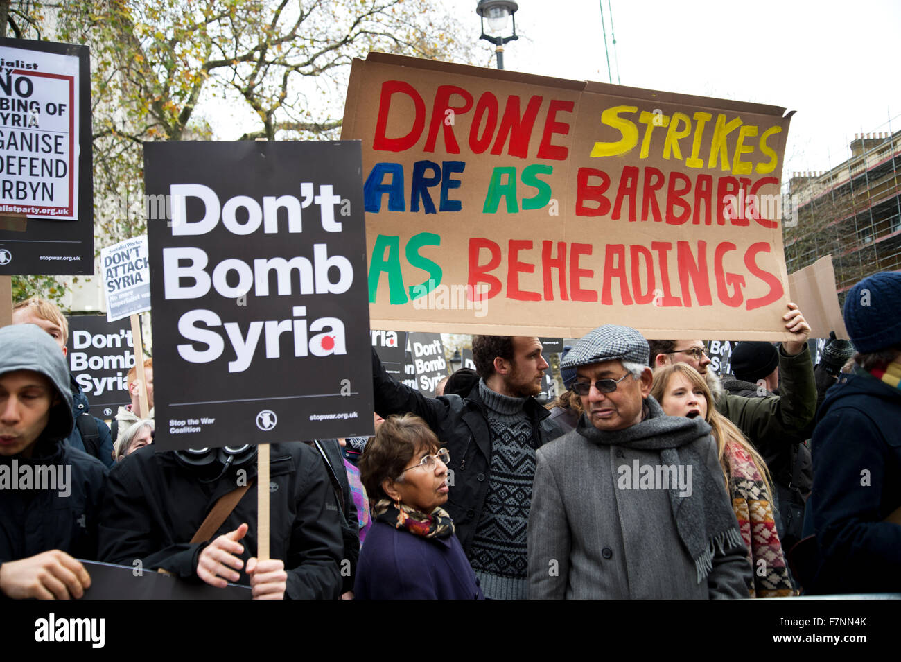 Don't bomb Syria.. A protester holds a handmade sign saying 'Drone ...