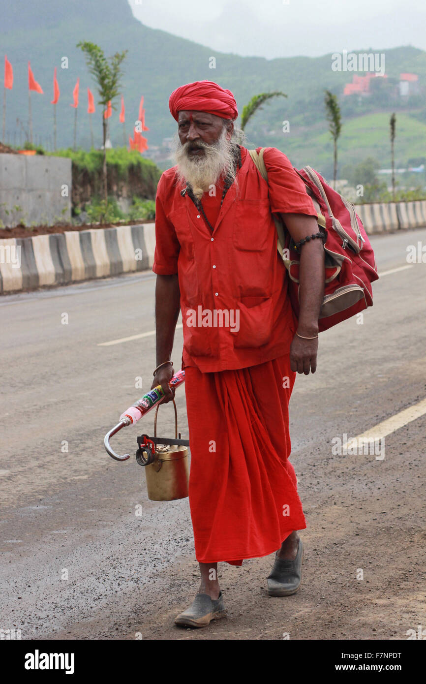 Sadhu walking on road Kumbh Mela, Nasik, Maharashtra, India Stock Photo ...