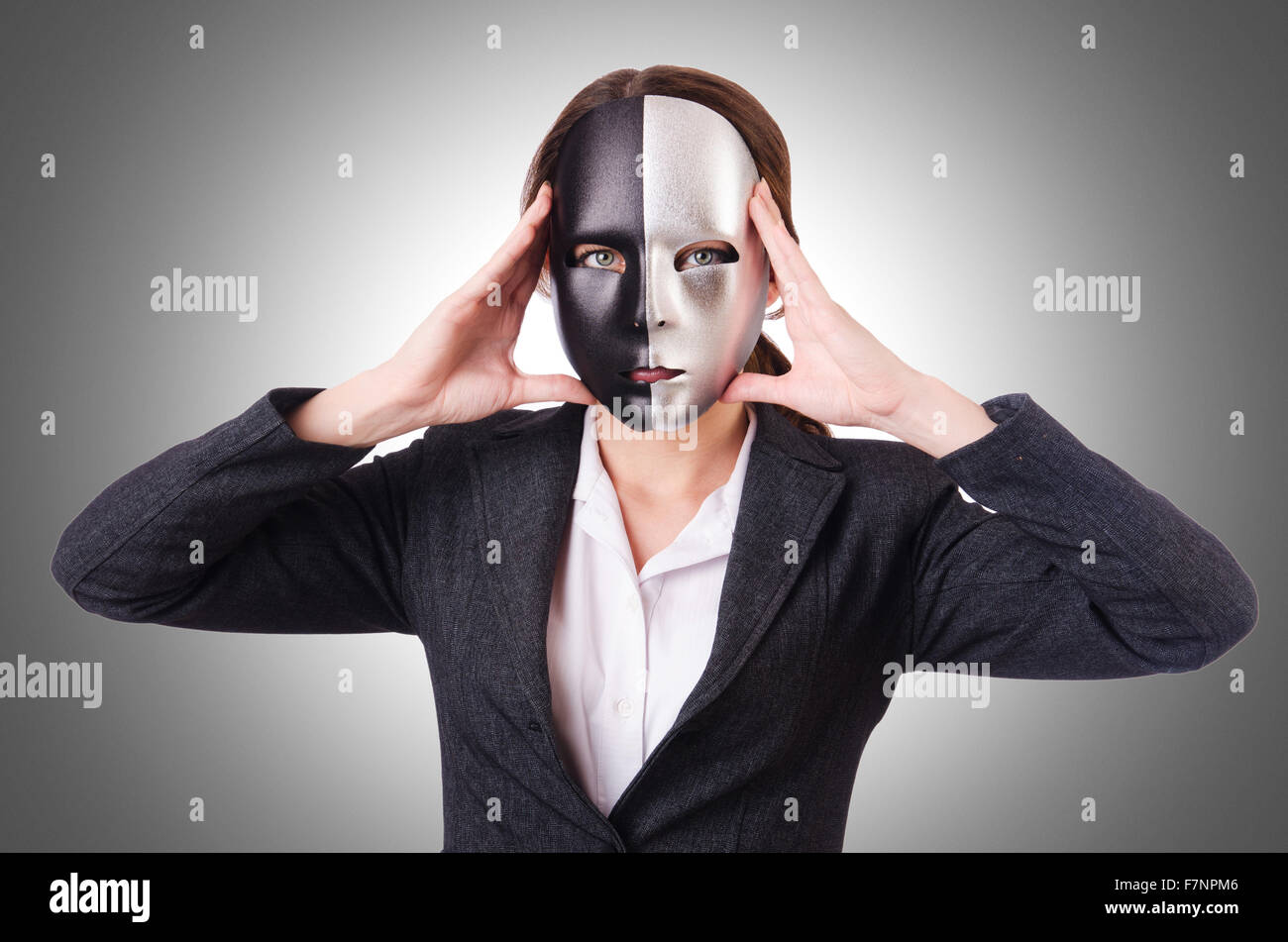 Woman with mask in hypocrisy concept Stock Photo - Alamy