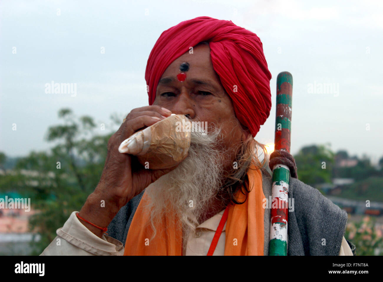 Man blowing conch shell hi-res stock photography and images - Alamy