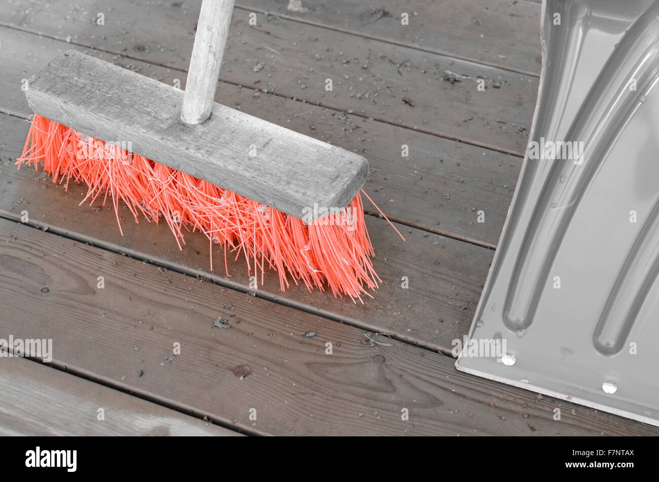 orange broom and snow shovel in spring Stock Photo - Alamy
