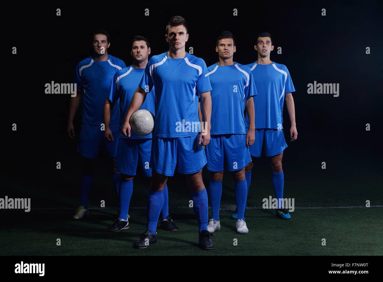 soccer players team group isolated on black background Stock Photo - Alamy