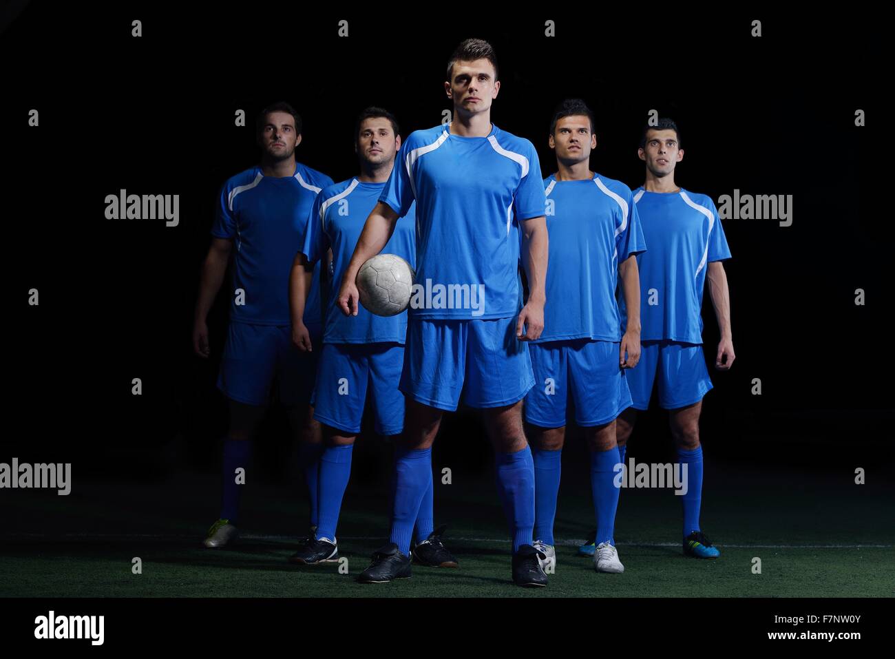 soccer players team group isolated on black background Stock Photo - Alamy