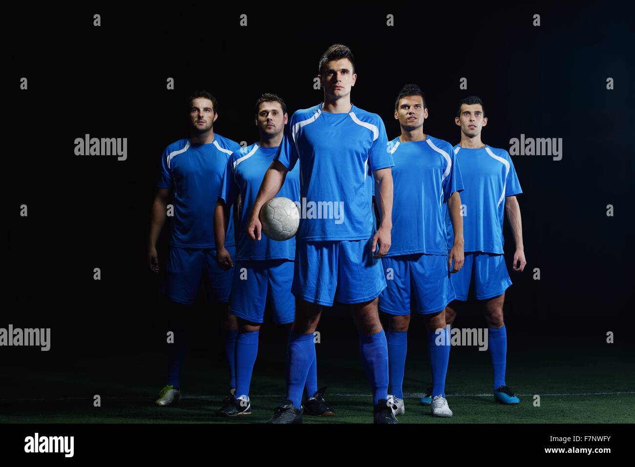 soccer players team group isolated on black background Stock Photo - Alamy
