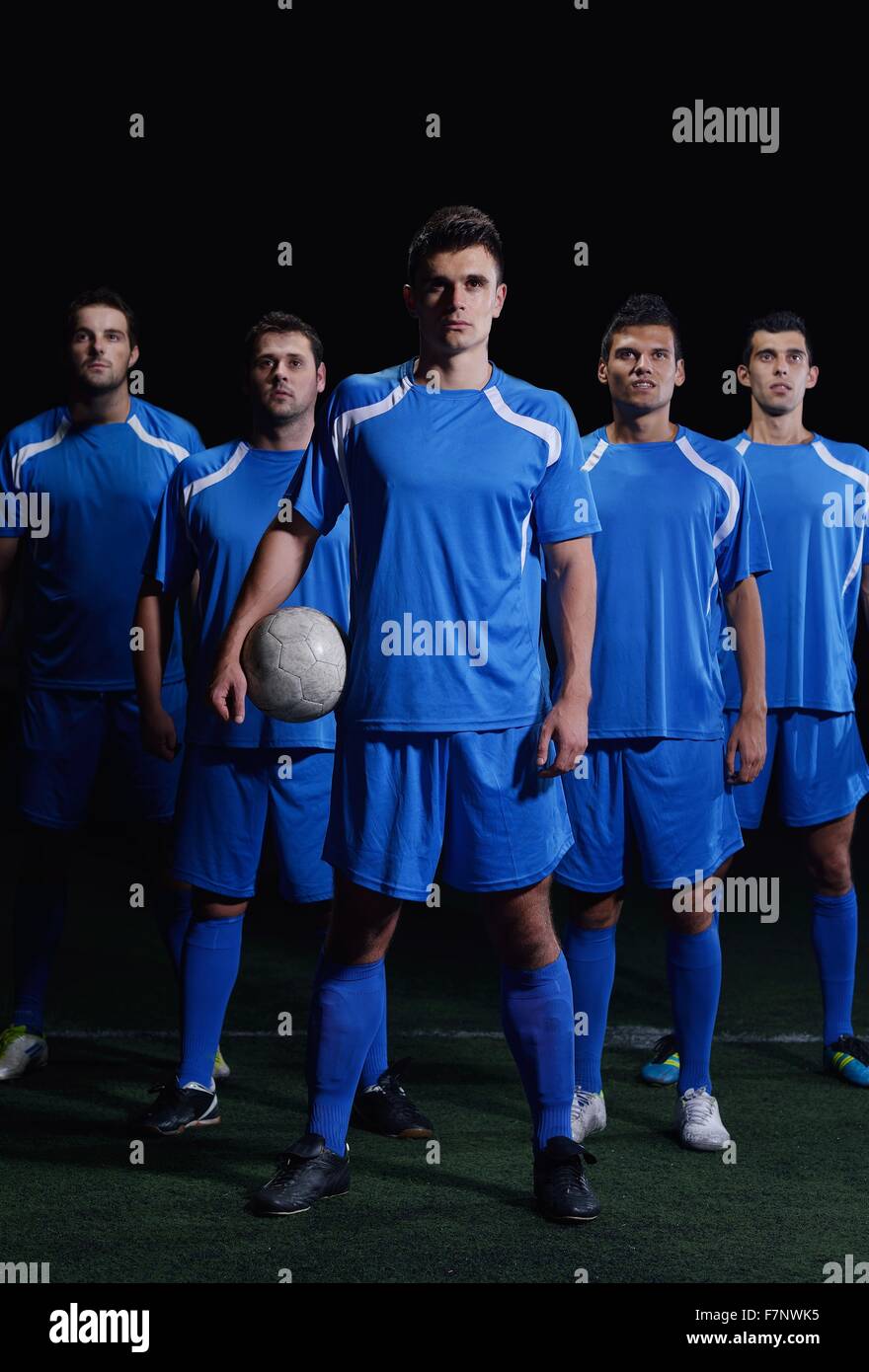 soccer players team group isolated on black background Stock Photo - Alamy