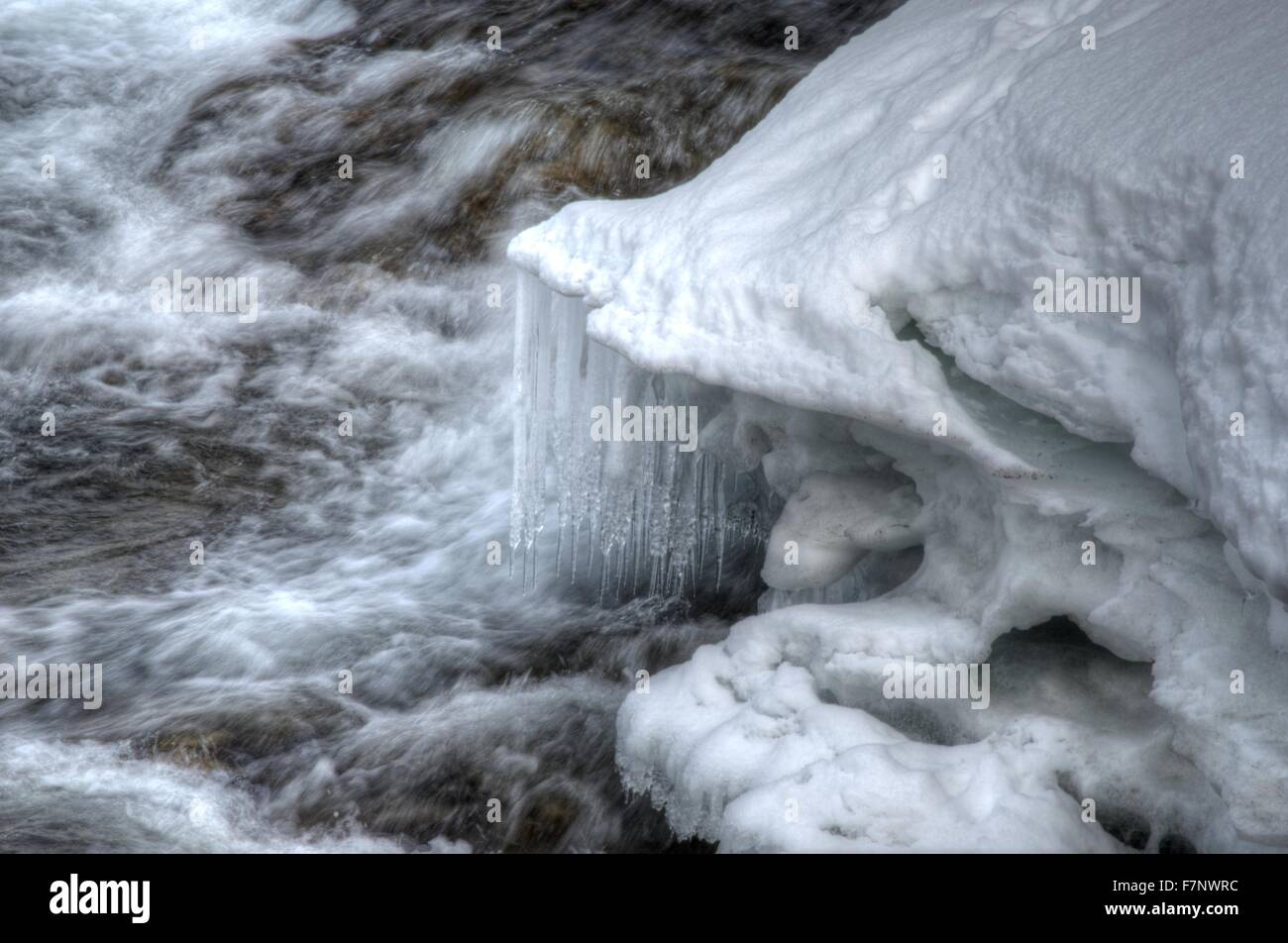 flowing rapid waterfall in winter with snow and ice Stock Photo - Alamy