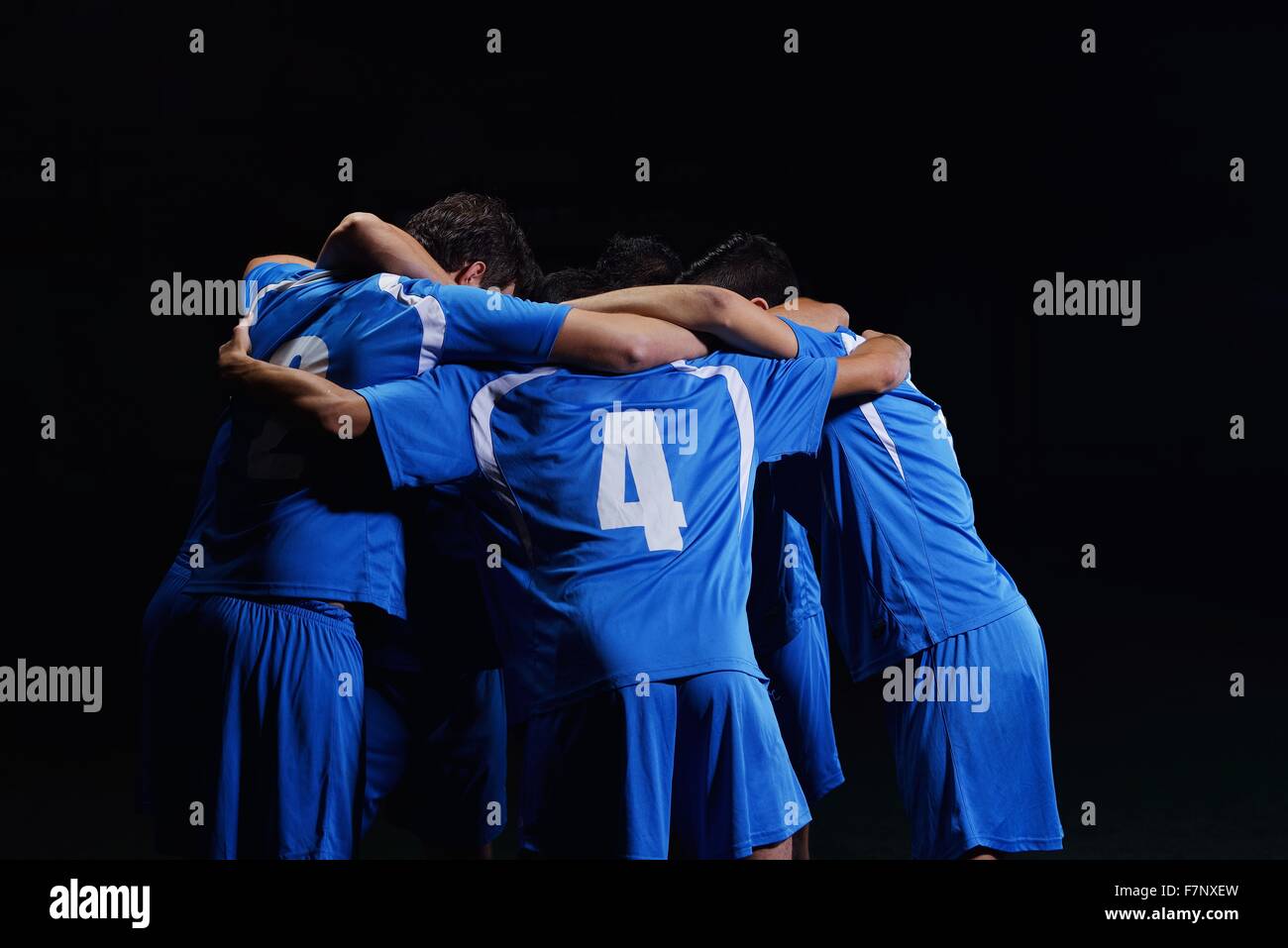 soccer players team group isolated on black background Stock Photo - Alamy