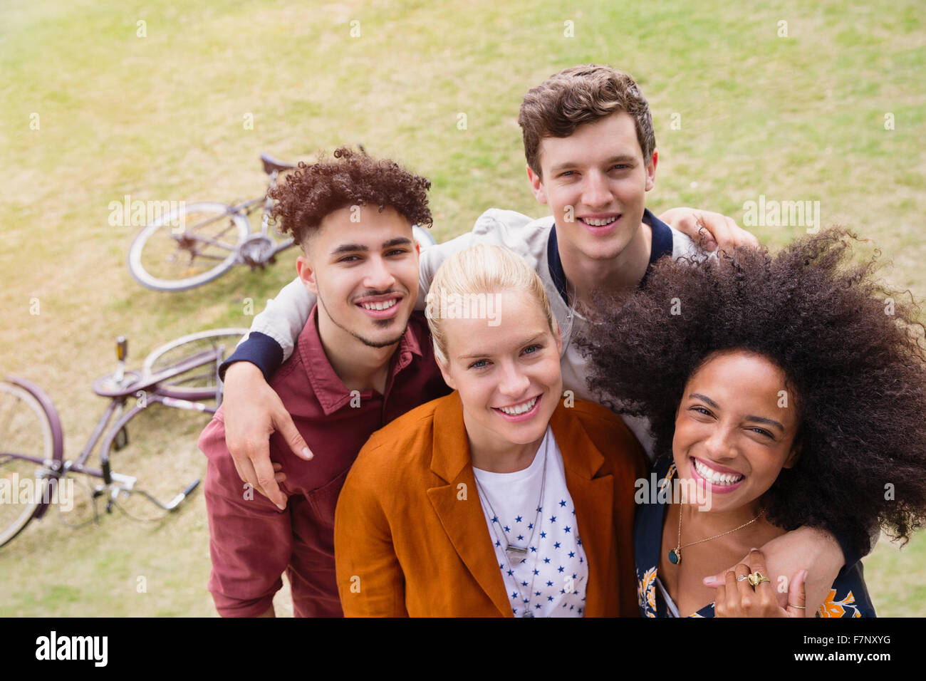 Four people hugging hi-res stock photography and images - Alamy