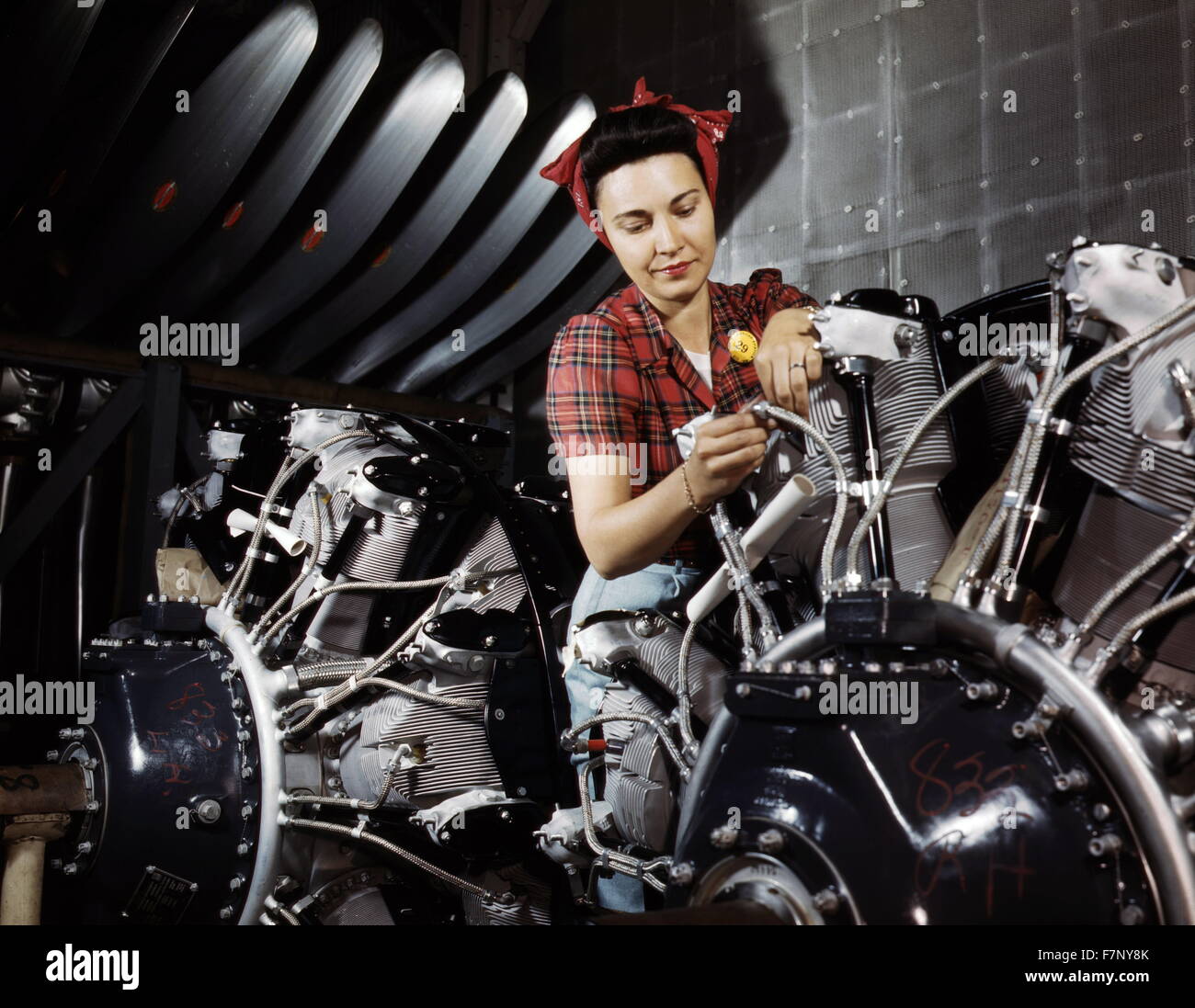 American woman working on an aircraft engine at a North American ...