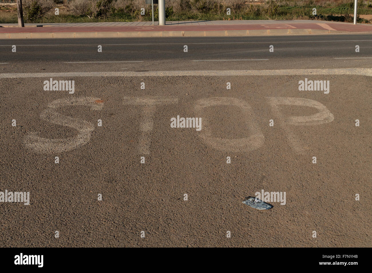 Stop written on road Stock Photo - Alamy