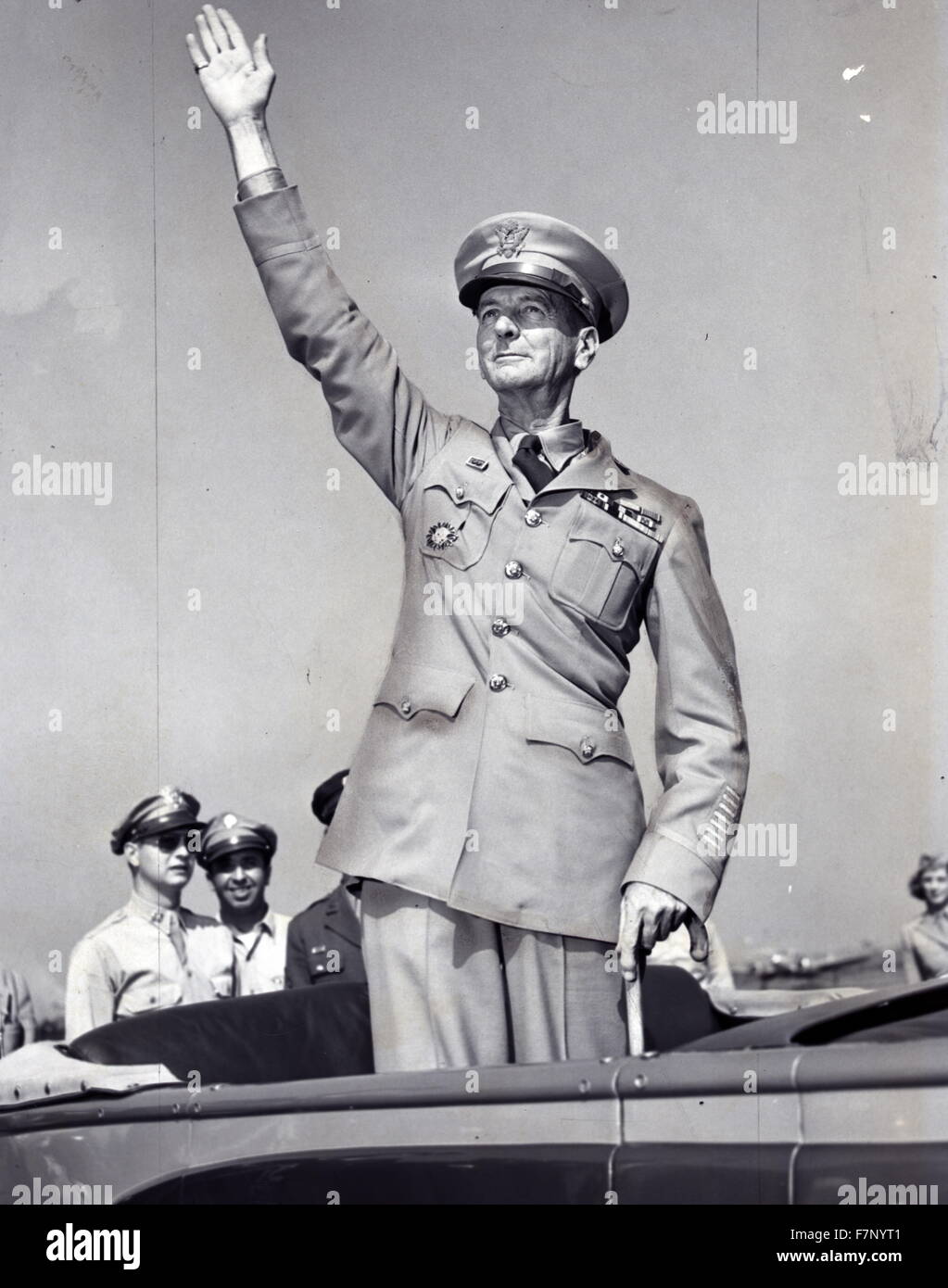 General Wainwright, standing in car, waving to crowd gathered at La ...