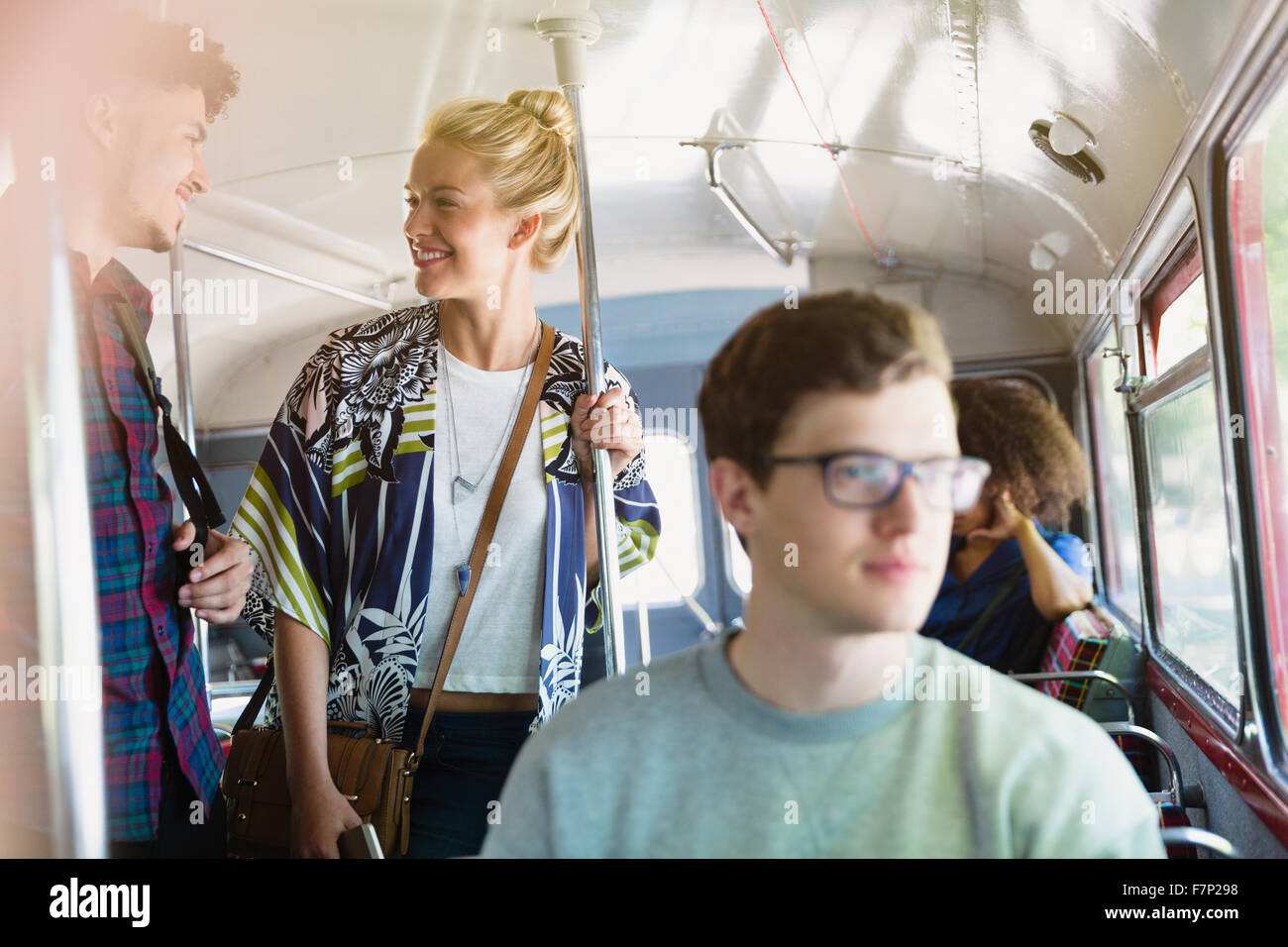 Friends talking on bus Stock Photo - Alamy