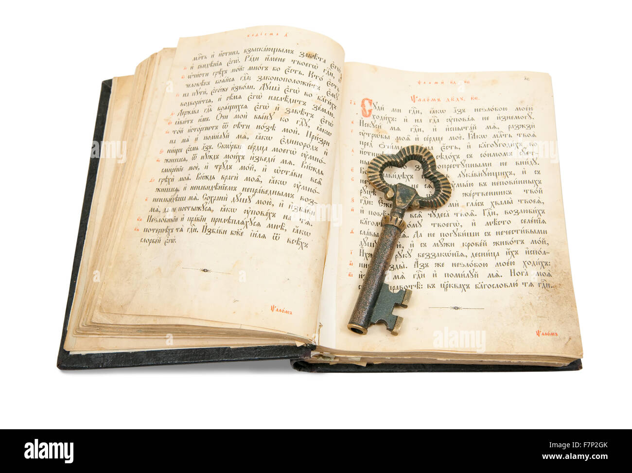 key placed on an 18st century vintage book, isolated on white Stock ...
