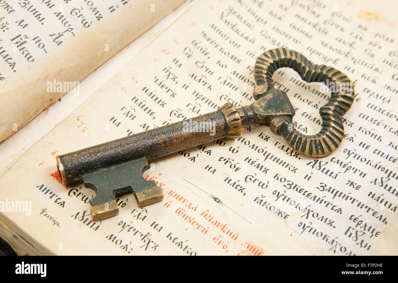 Background of Closeup of key placed on an 18st century vintage bible ...