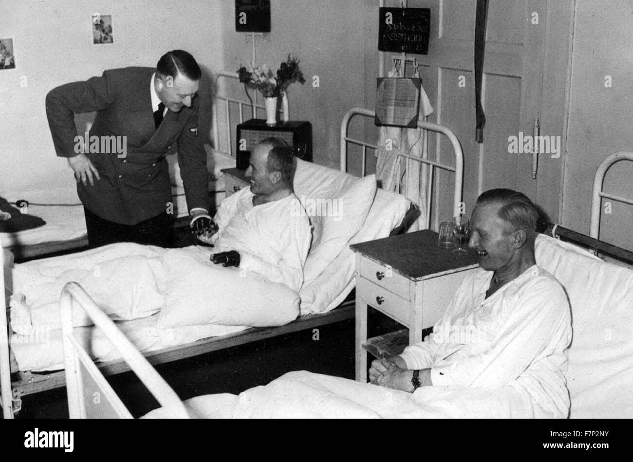 German Chancellor Adolf Hitler visits war wounded in a military ...