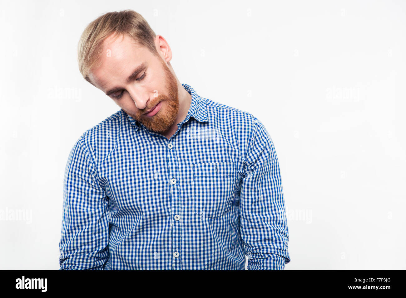 Portrait of a young man standing and sleeping isolated on a white ...