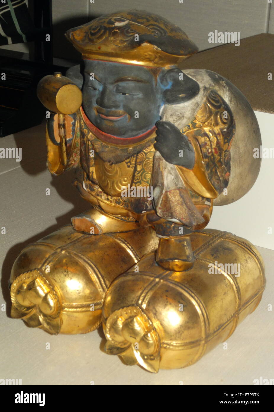 Wooden statue of the lucky god Daikokuten, one of the Seven Lucky Gods ...