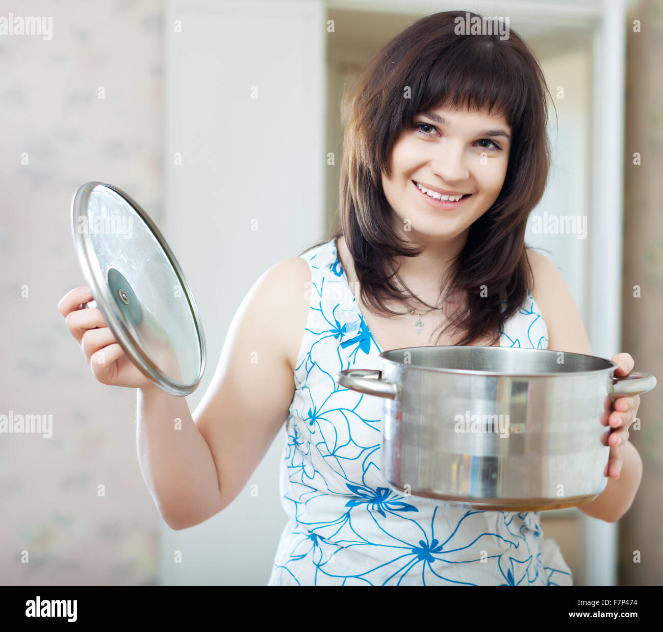 ordinary woman with cook pan at kitchen Stock Photo - Alamy