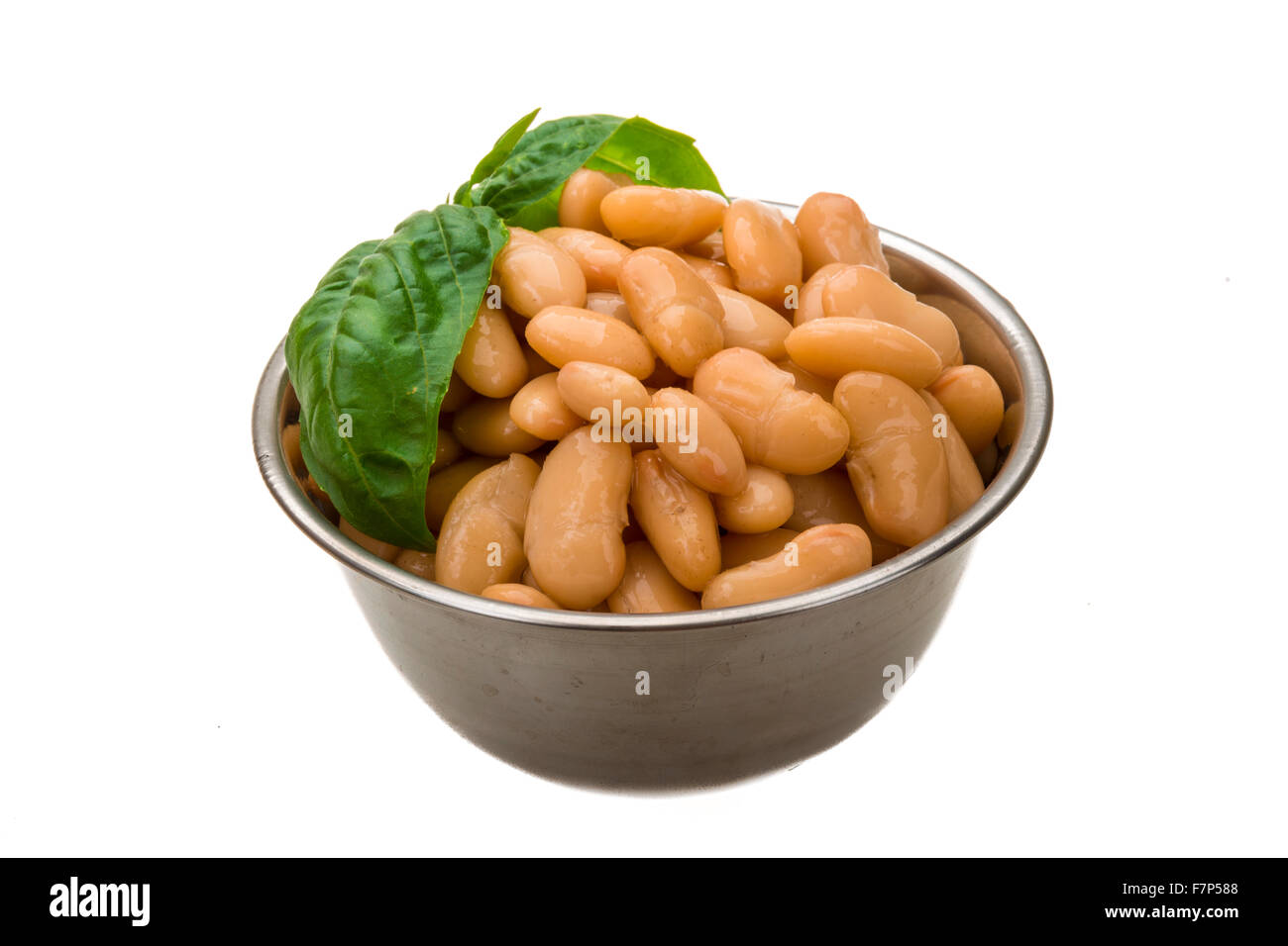 Tinned bean with basil leaf Stock Photo - Alamy