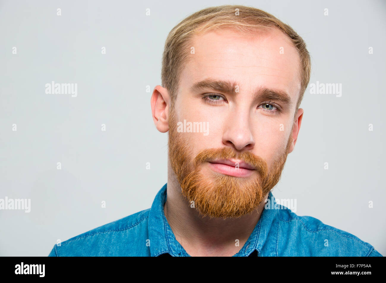 Portrait of serious thoughtful bearded handsome young man looking ... Portrait of serious thoughtful bearded handsome young man looking ...