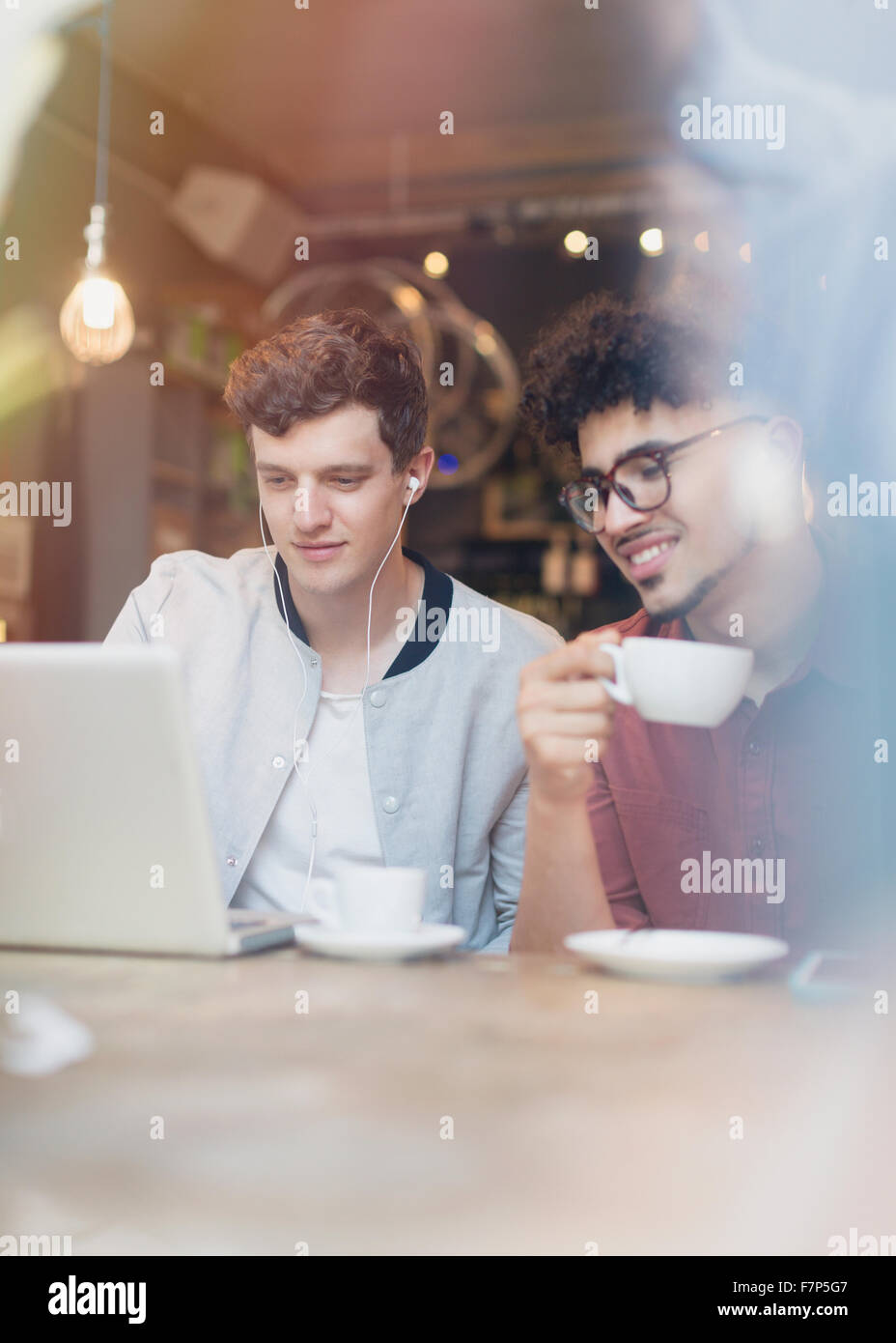 Friends sharing coffee in cafe hi-res stock photography and images - Alamy
