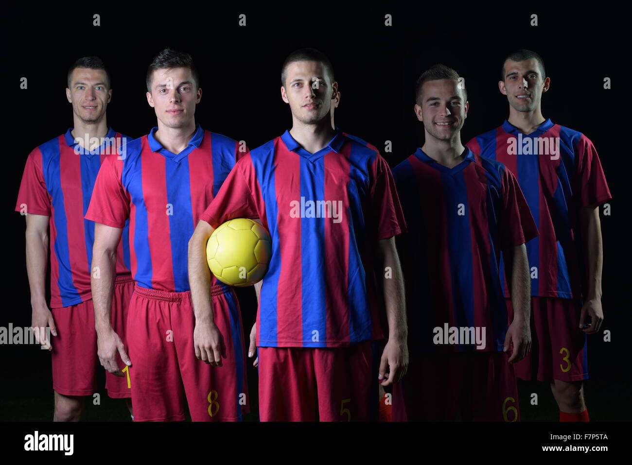 soccer players team group isolated on black background Stock Photo - Alamy