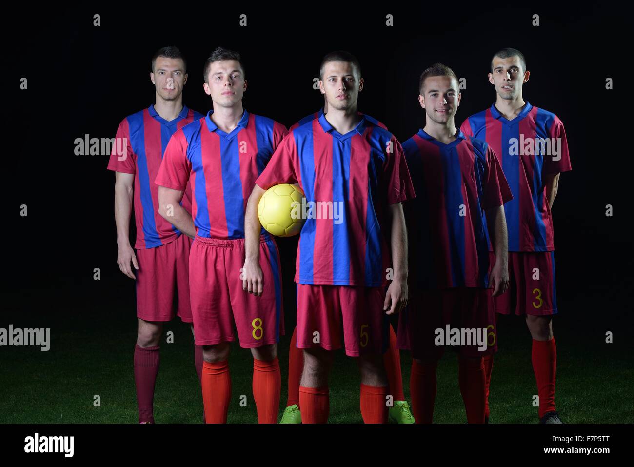 soccer players team group isolated on black background Stock Photo - Alamy