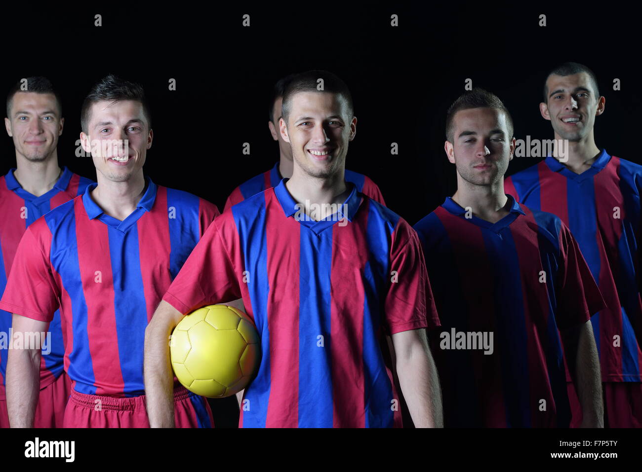 soccer players team group isolated on black background Stock Photo - Alamy