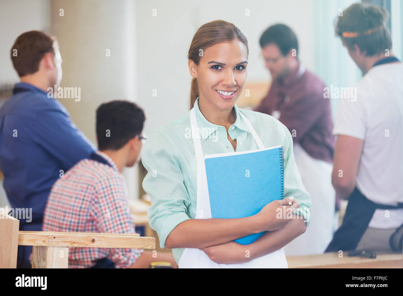 Portrait smiling student in adult education carpentry class Stock Photo ...