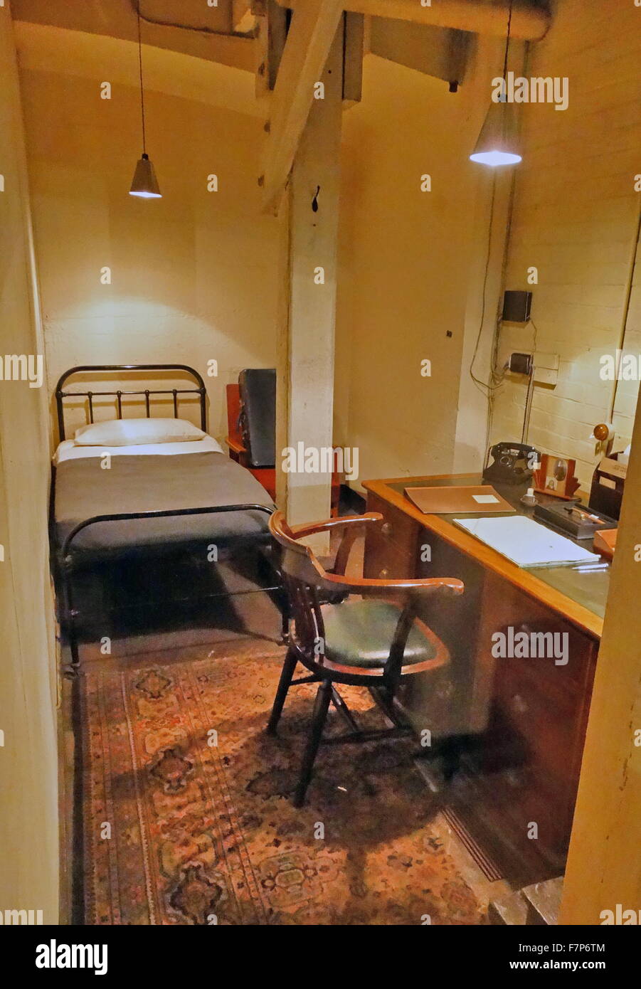 bedroom with desk and telephone in the Cabinet war rooms bunker, London; England. The War rooms ...
