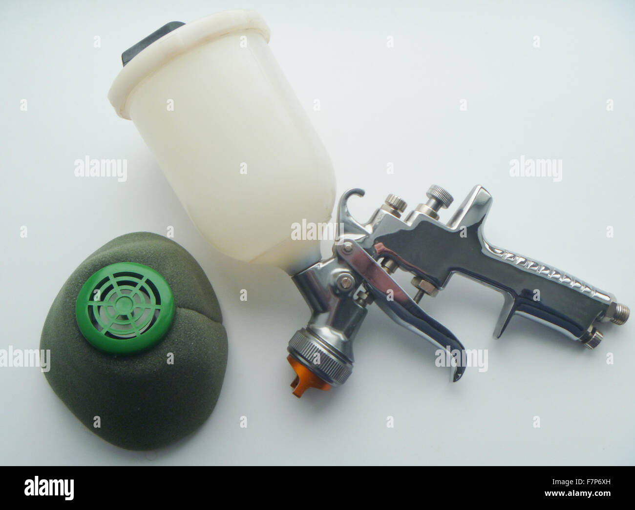 Building gun for paint and means of protection on light background ...