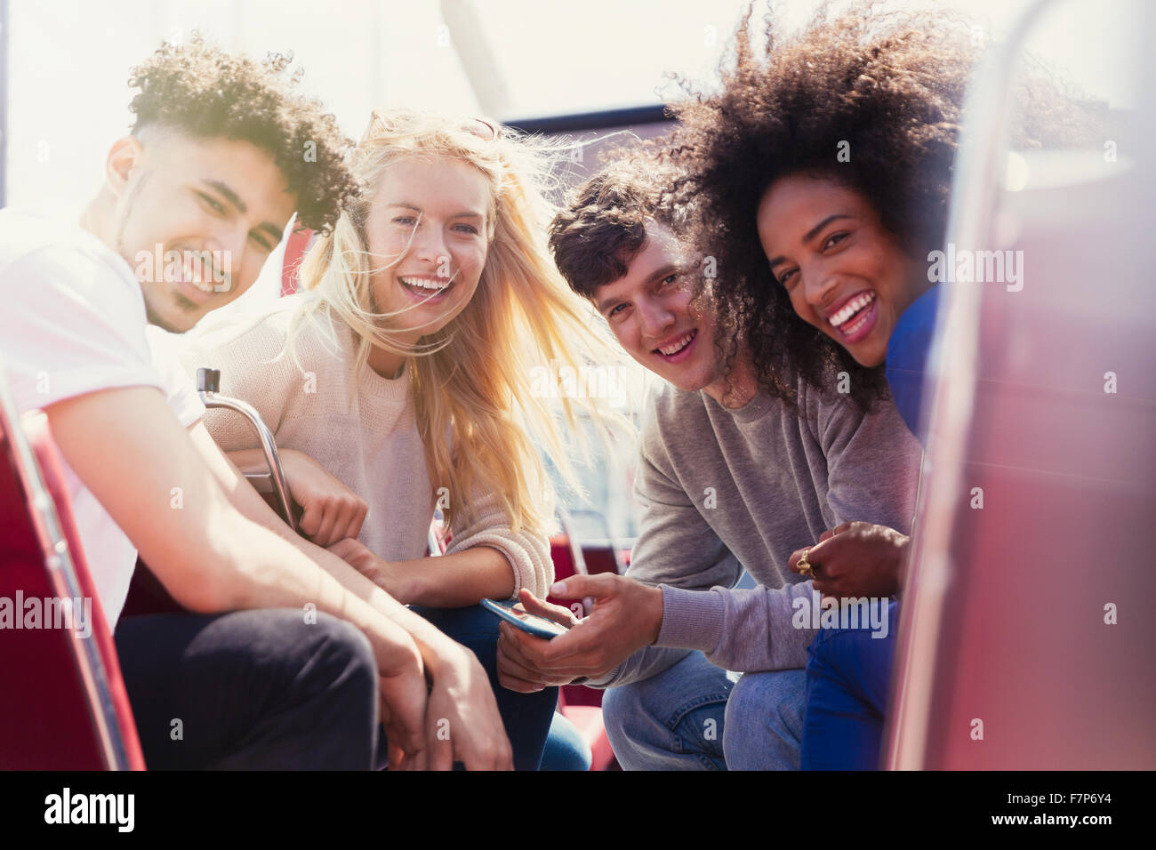 Portrait smiling friends riding double-decker bus Stock Photo - Alamy