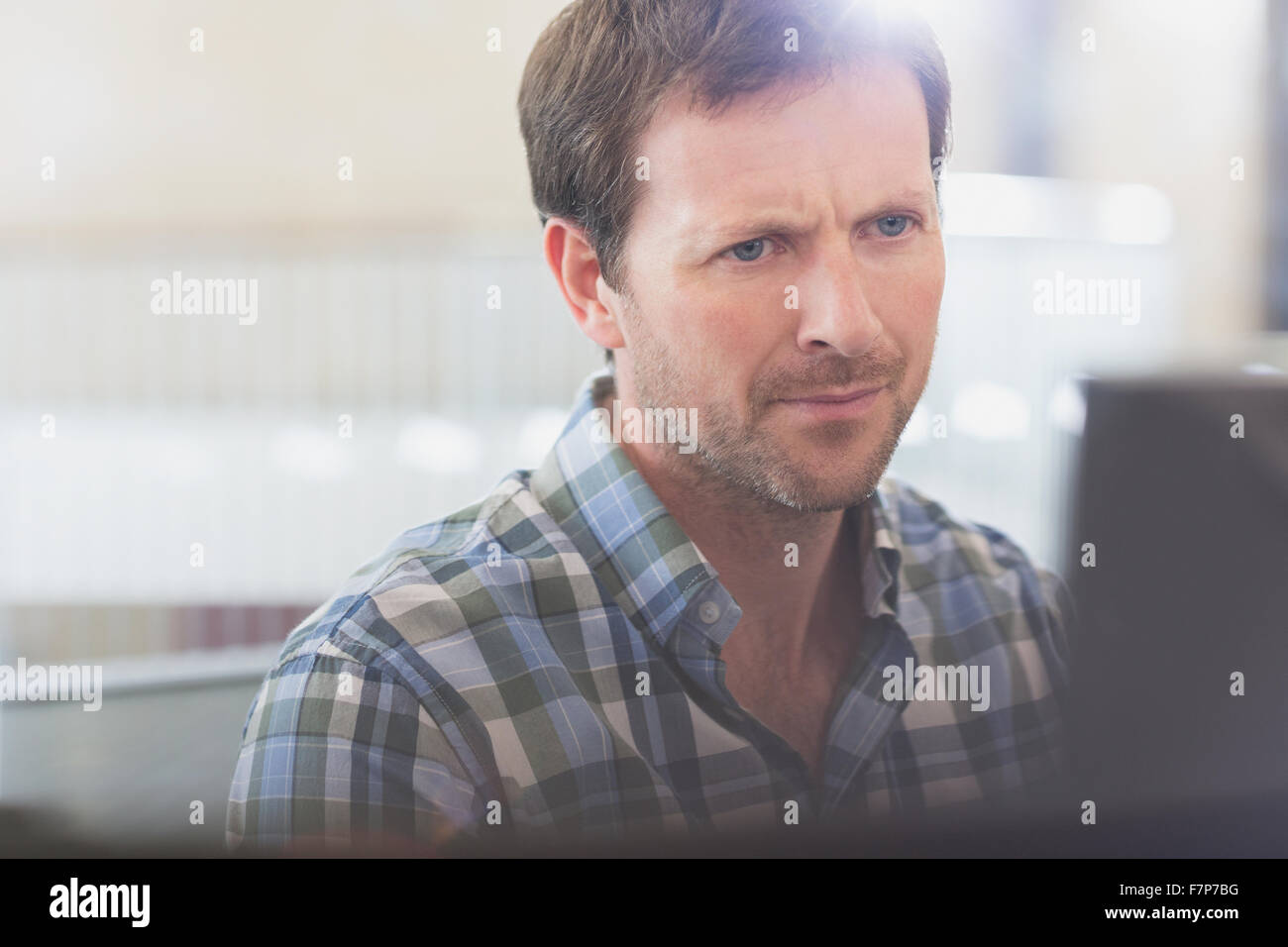 Focused businessman working at computer Stock Photo - Alamy