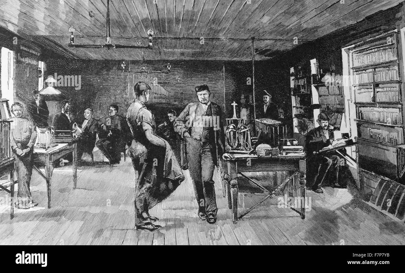 Thomas Alva Edison 1847-1931, centre, in his laboratory at Menlo Park ...