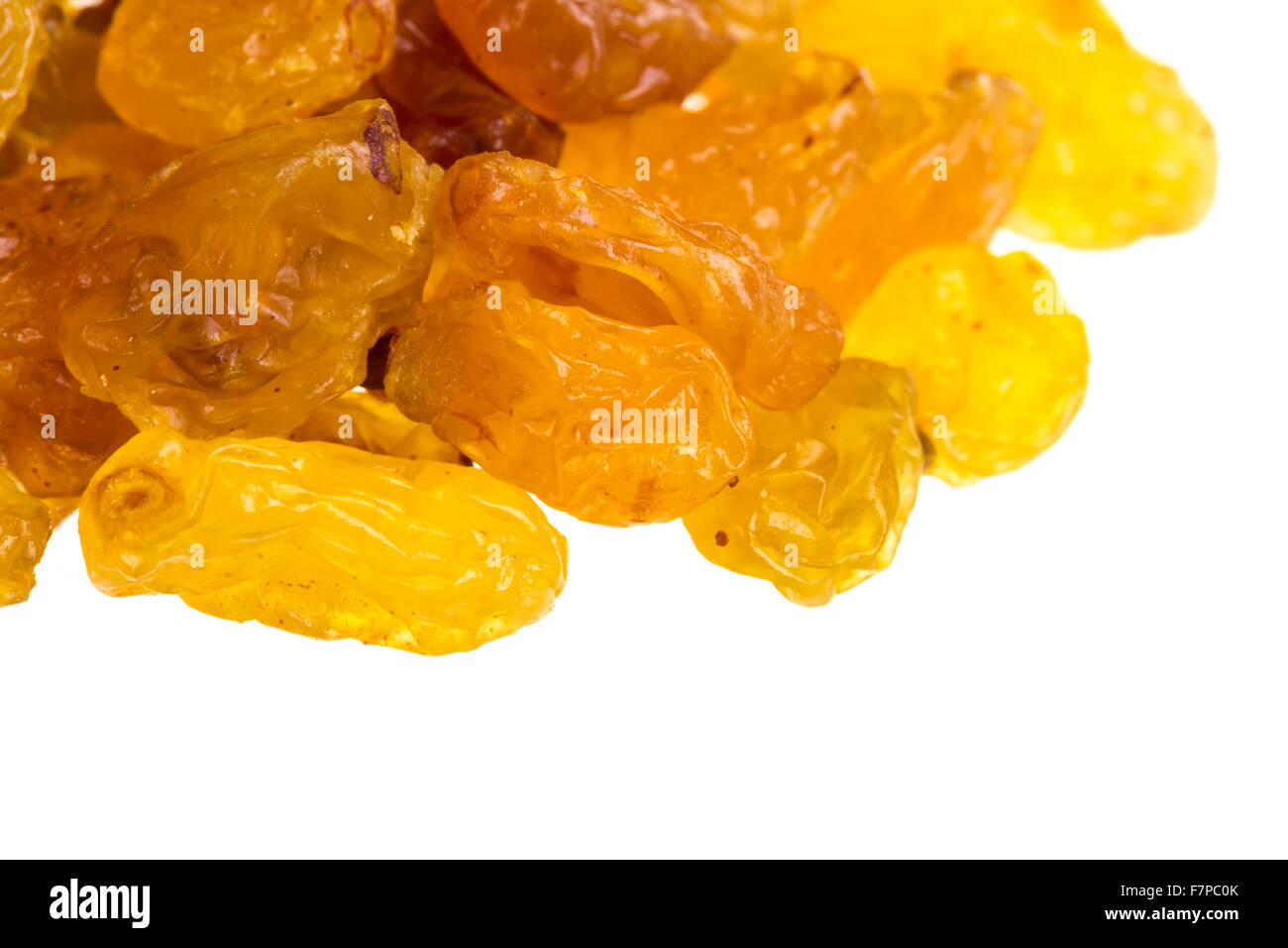 Golden raisins over white Stock Photo - Alamy