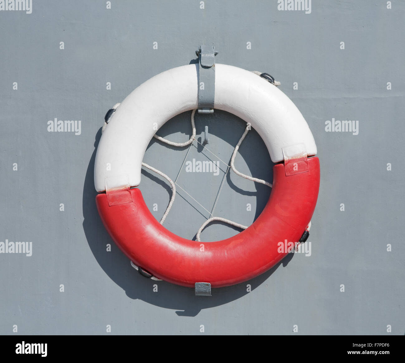 lifebuoy on a grey wall of ship Stock Photo - Alamy