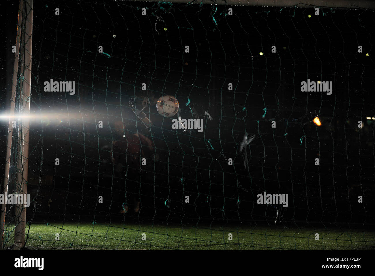 soccer football goal keeper in night with falling rain Stock Photo - Alamy