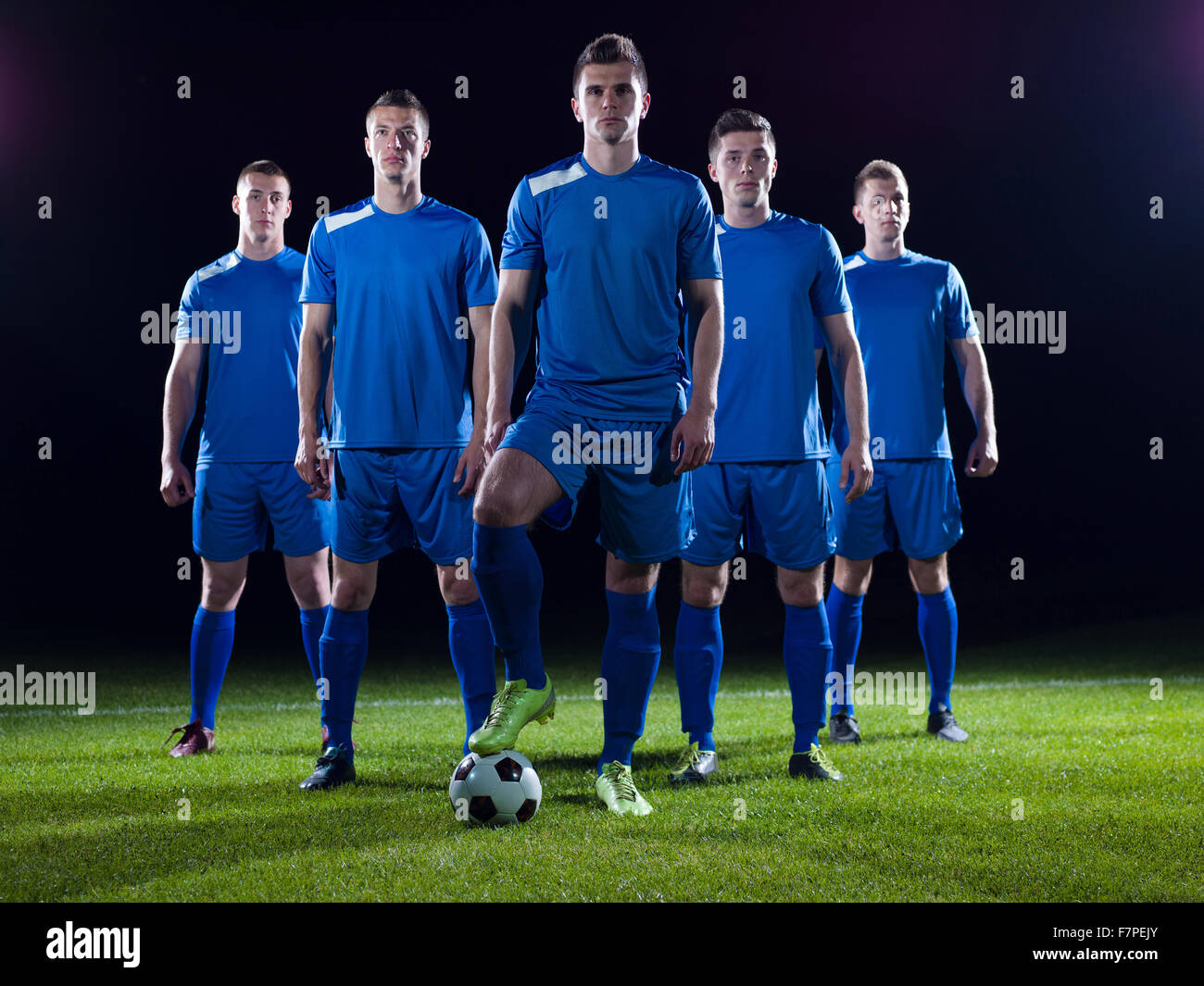 soccer players team group isolated on black background Stock Photo - Alamy
