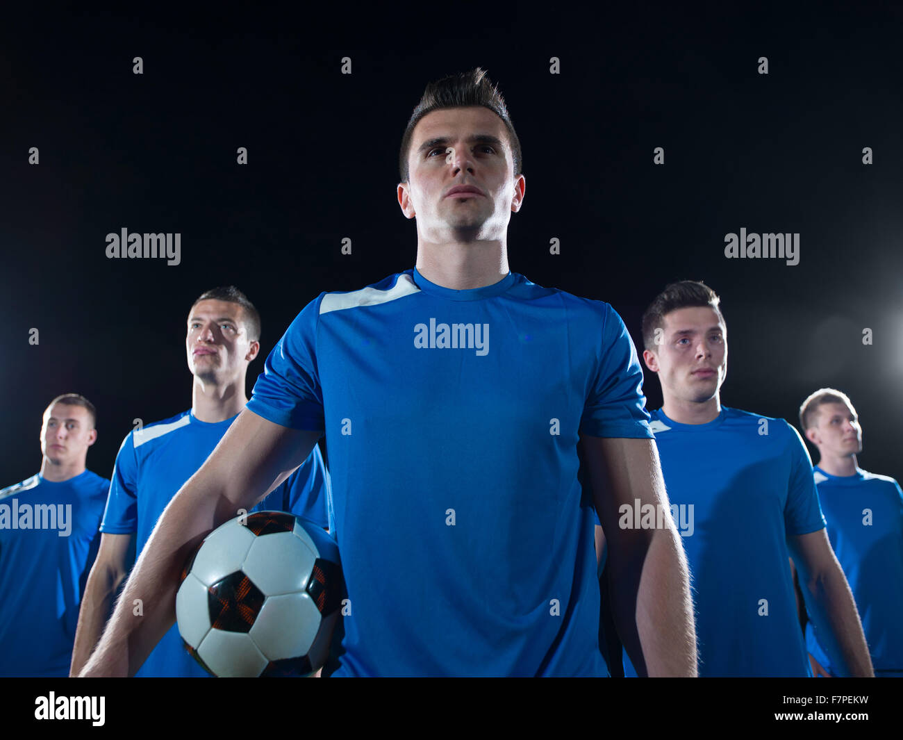 soccer players team group isolated on black background Stock Photo - Alamy