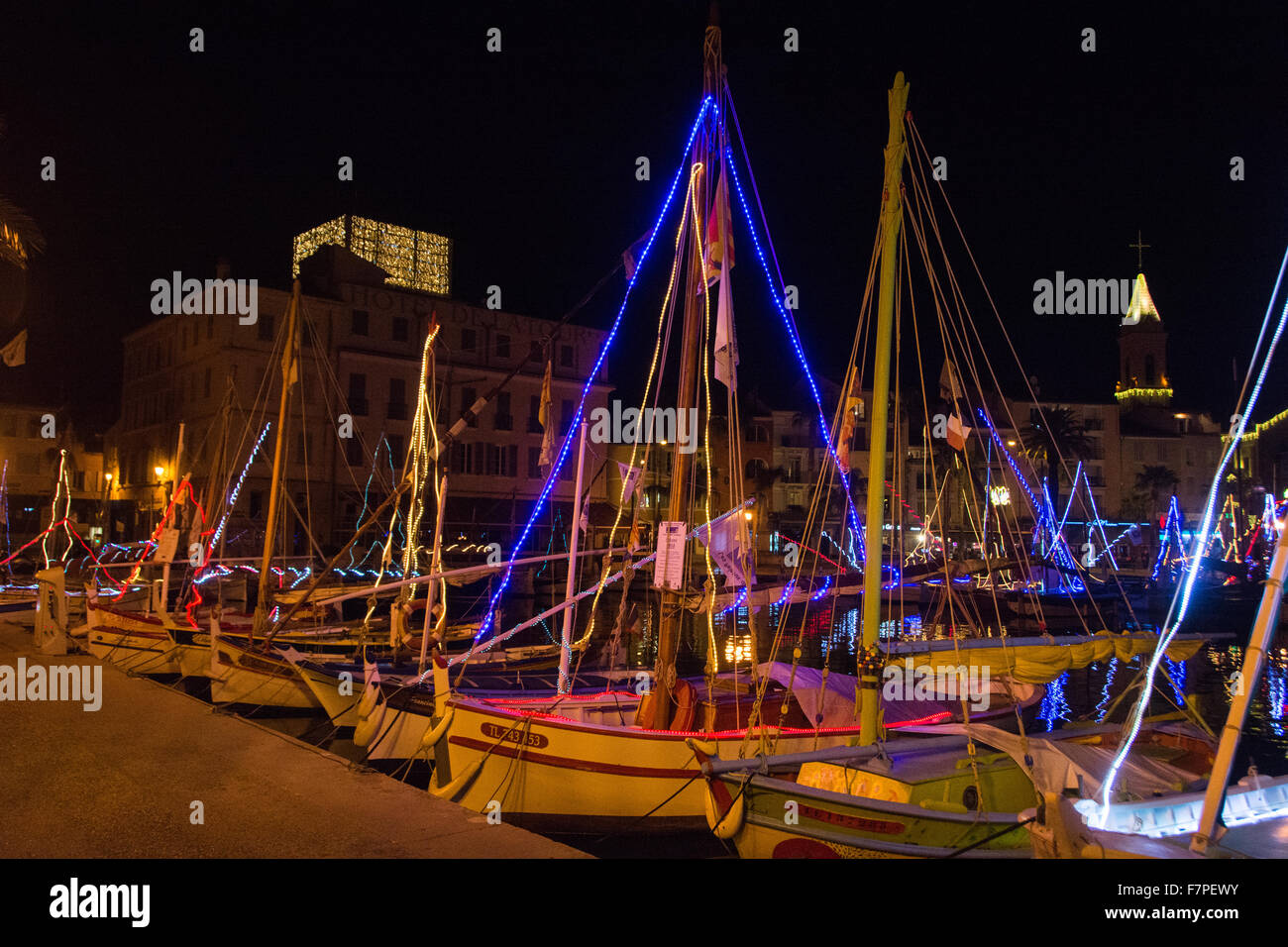 Classic pointus fishing boats of Sanary-sur-mer with Christmas lights ...
