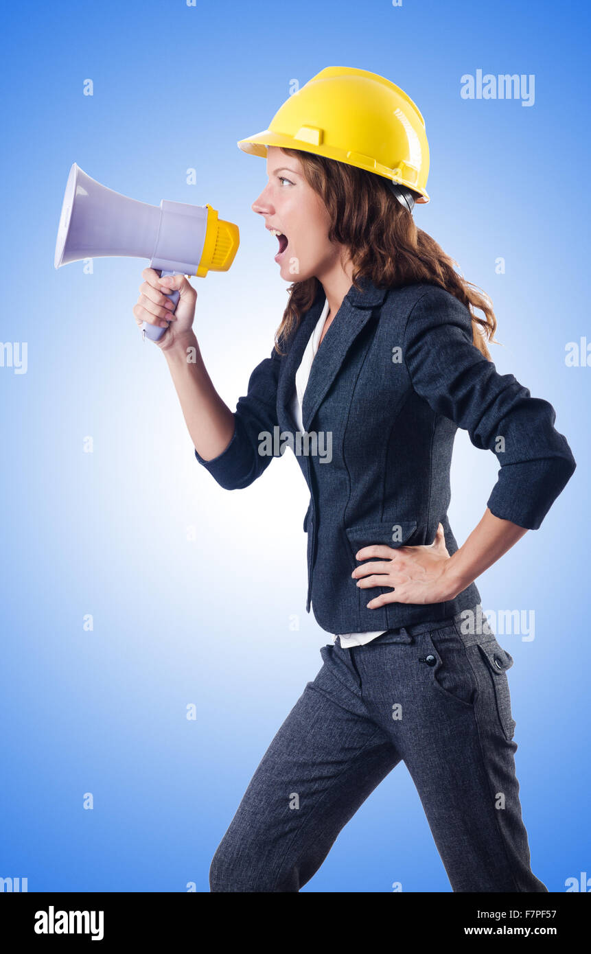 Female construction worker with loudspeaker Stock Photo - Alamy