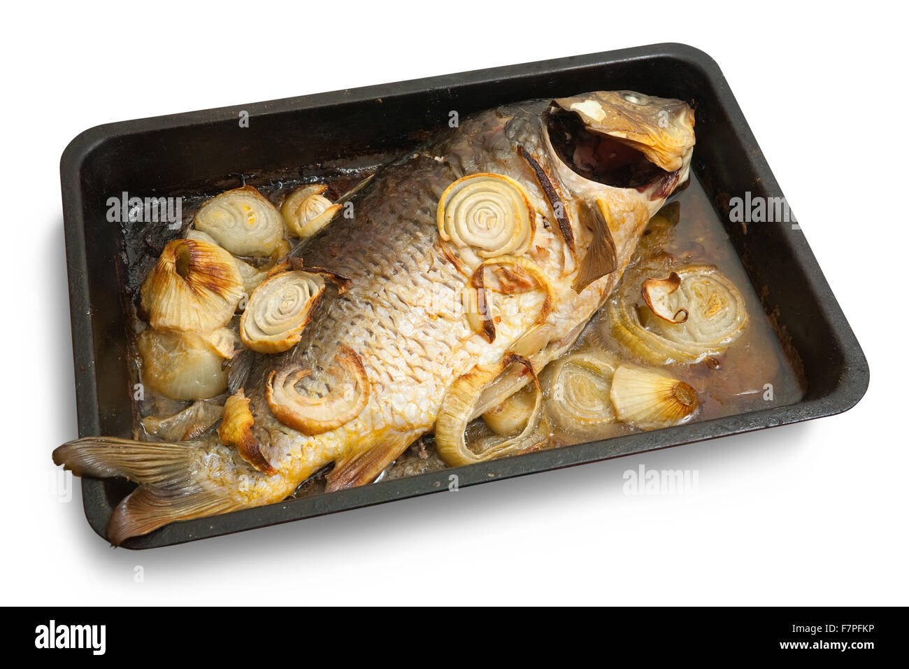 Grilled carp fish on the cook griddle. Isolated with clipping path ...