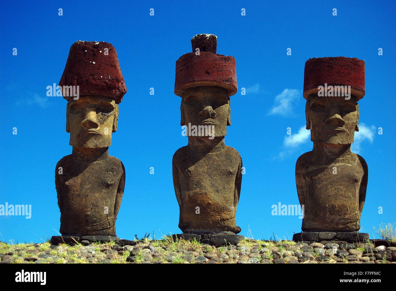 Easter Island and the Moai with red topknot hats at Anakena Ahu. Easter ...