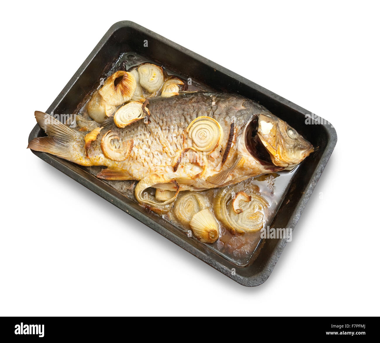 Grilled carp fish on the cook griddle. Isolated with clipping path ...