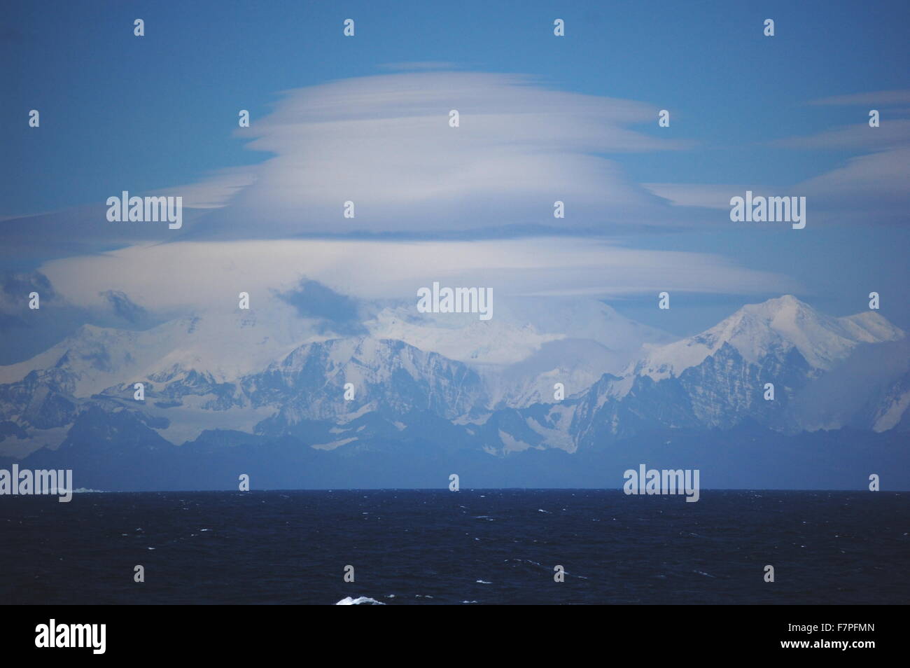 Photograph of Lenticular clouds, are stationary lens-shaped clouds that ...