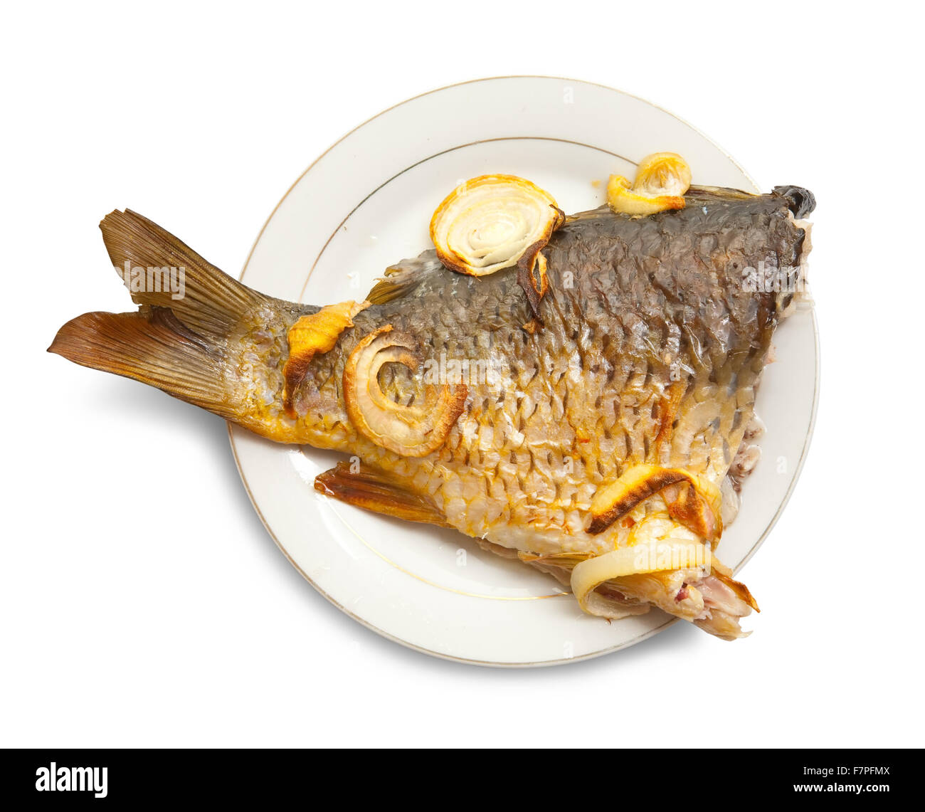 Grilled carp fish on the white plate over white Stock Photo - Alamy